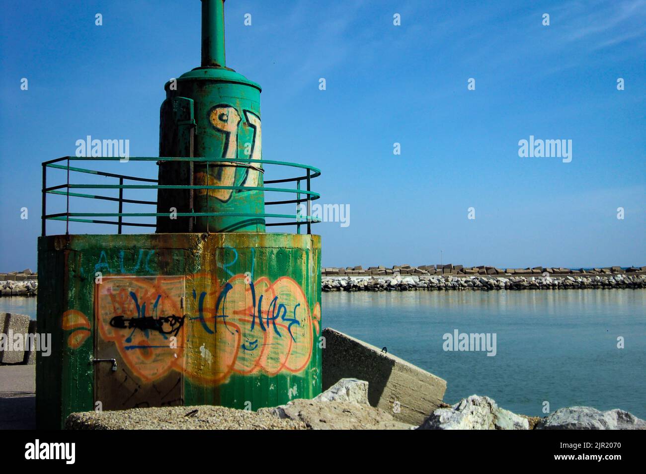 Magnificent wallpaper depicting an old lighthouse in a beautiful pier ...