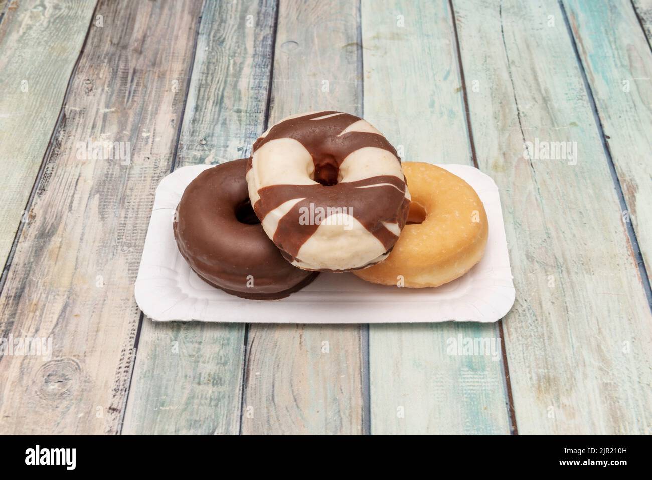 There are many types of donuts: some are glazed with various colors and ...