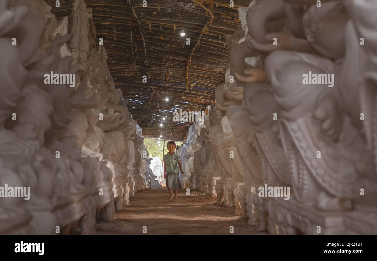 Pileru, India - July 28,2022: Kid walking through ganesha idols. Lord ...