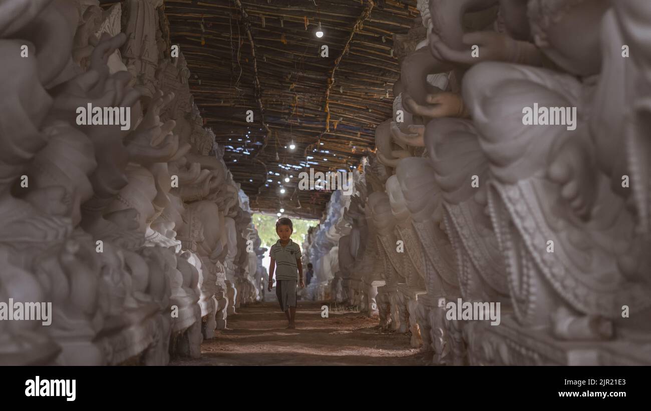 Pileru, India - July 28,2022: Kid looking at camera while walking ...