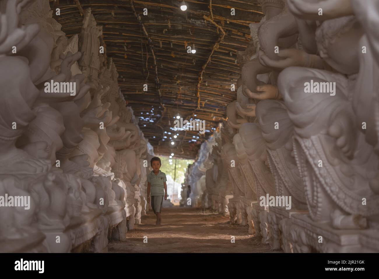 Pileru, India - July 28,2022: Young kid walking in golden hour. ganesha ...