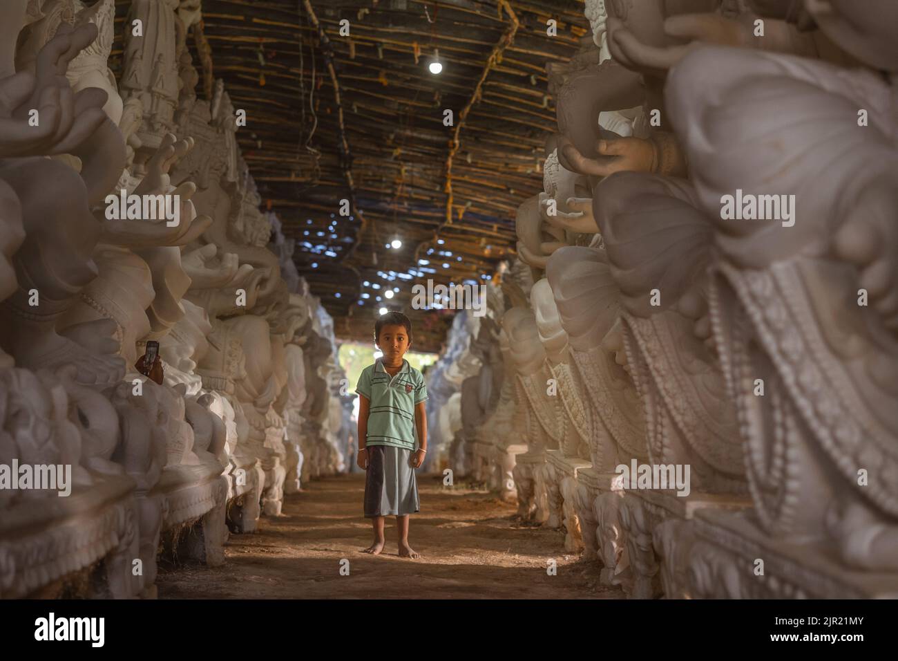 Pileru, India - July 28,2022: Boy standing in front of Lord ganesha ...