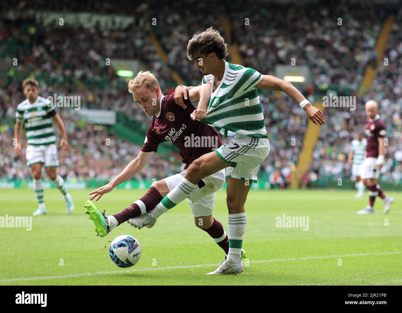 Heart of Midlothian's Nathaniel Atkinson (left) and Celtic's Jota ...