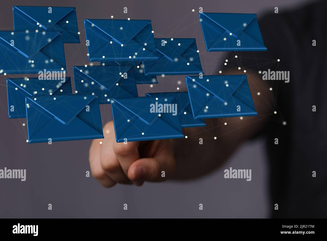A finger touching a 3d rendering of floating connected blue message ...