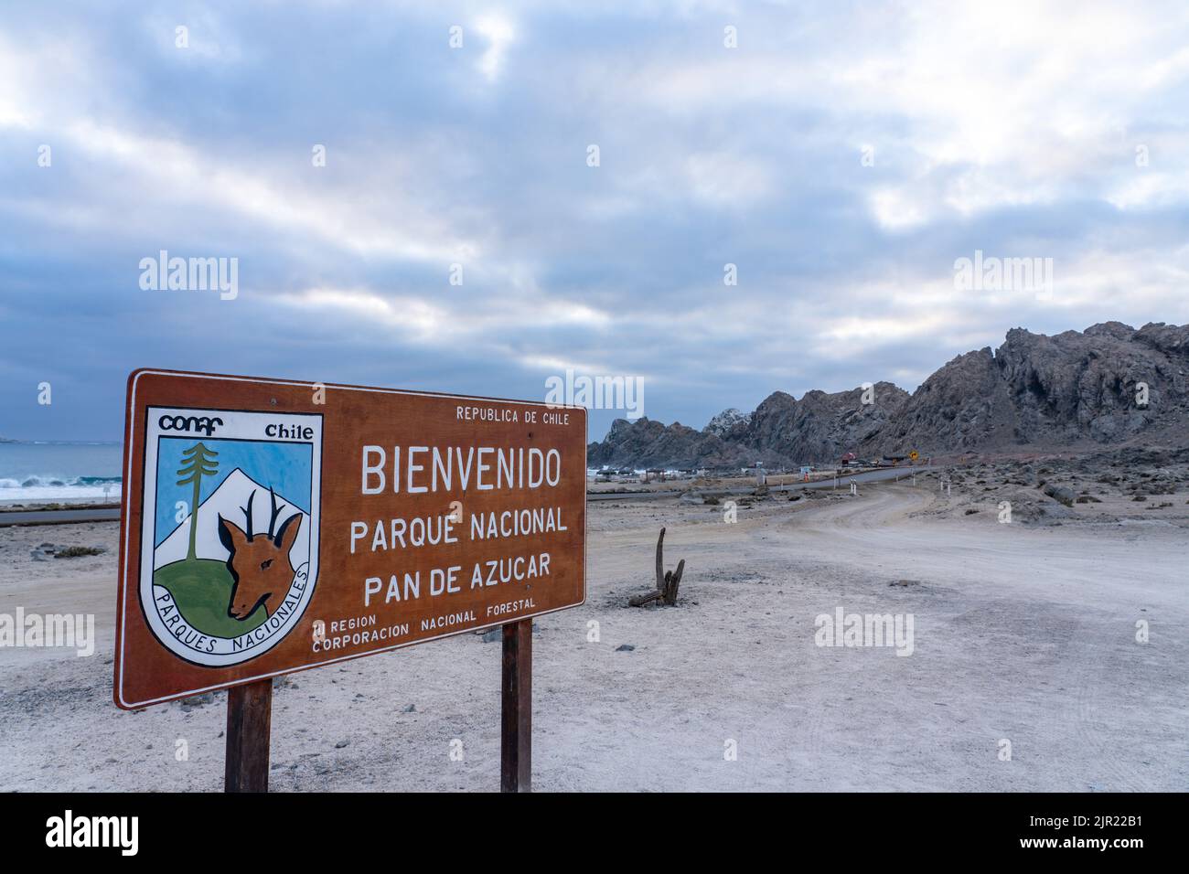 A welcome sign for Pan de Azucar National Park in the Atacama Desert of ...