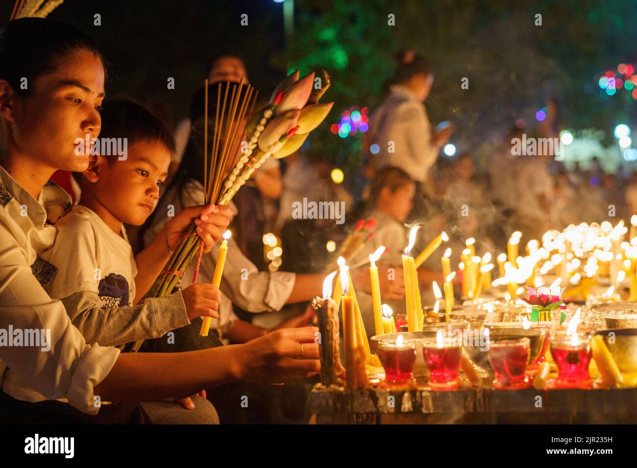 A mother and daughter celebrating Cambodia's Pchum Ben festival with ...