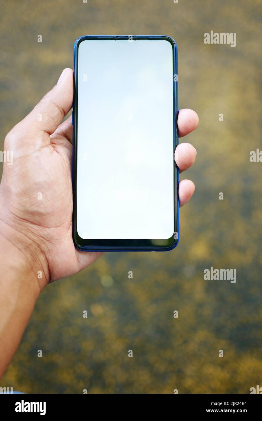 Close up of young man hand using smart phone with green screen Stock ...