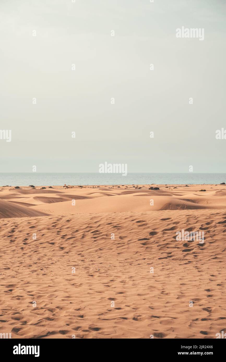 A vertical shot of desert during the day under the clear sky Stock ...