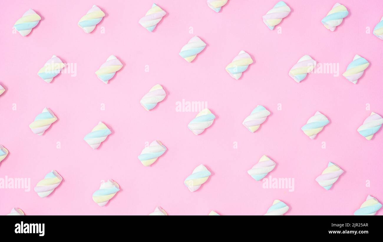 Creative colorful marshmallow pattern on pastel pink background. Flat ...