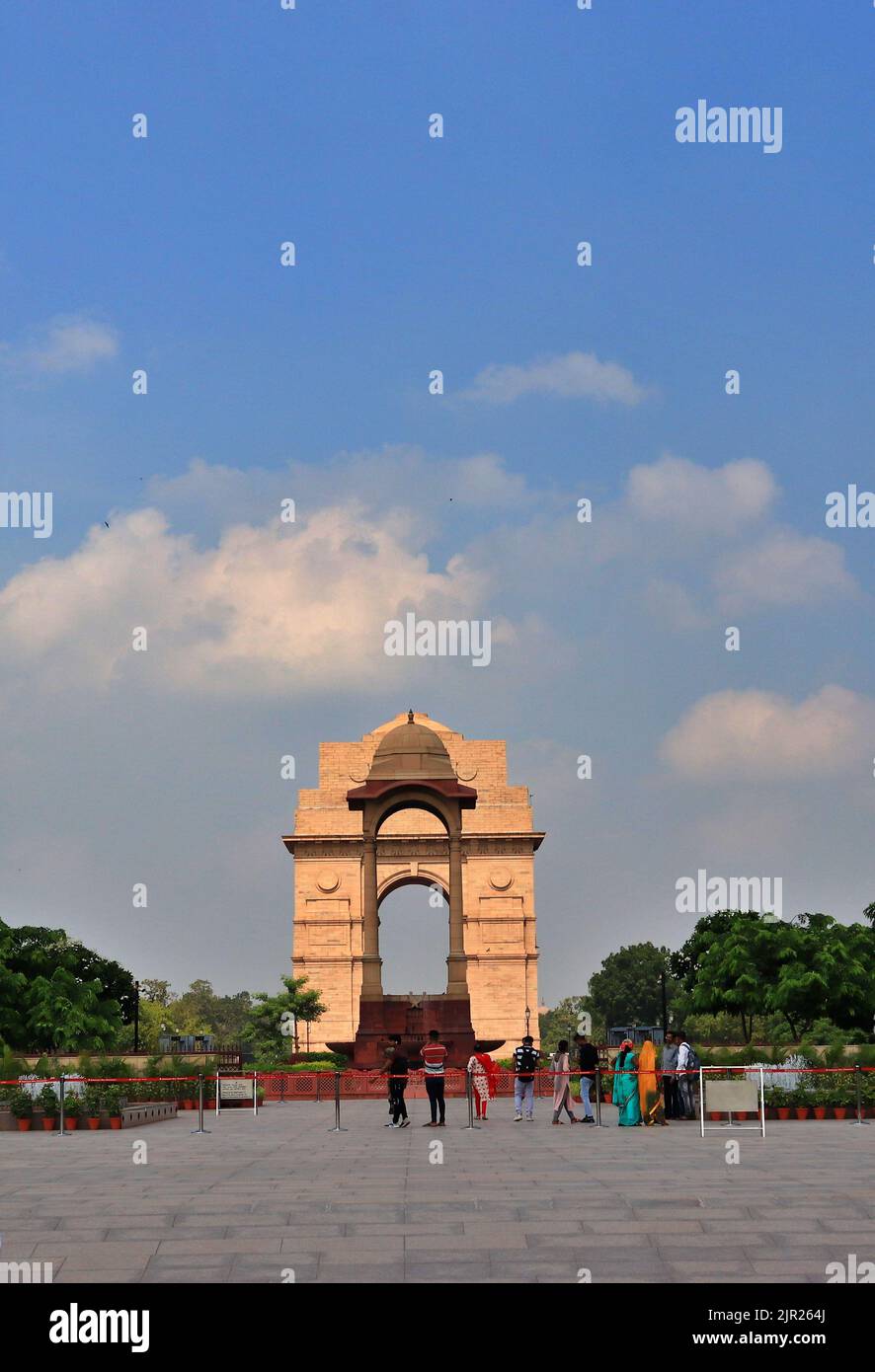 The India Gate and the Canopy against blue sky and clouds/New Delhi ...