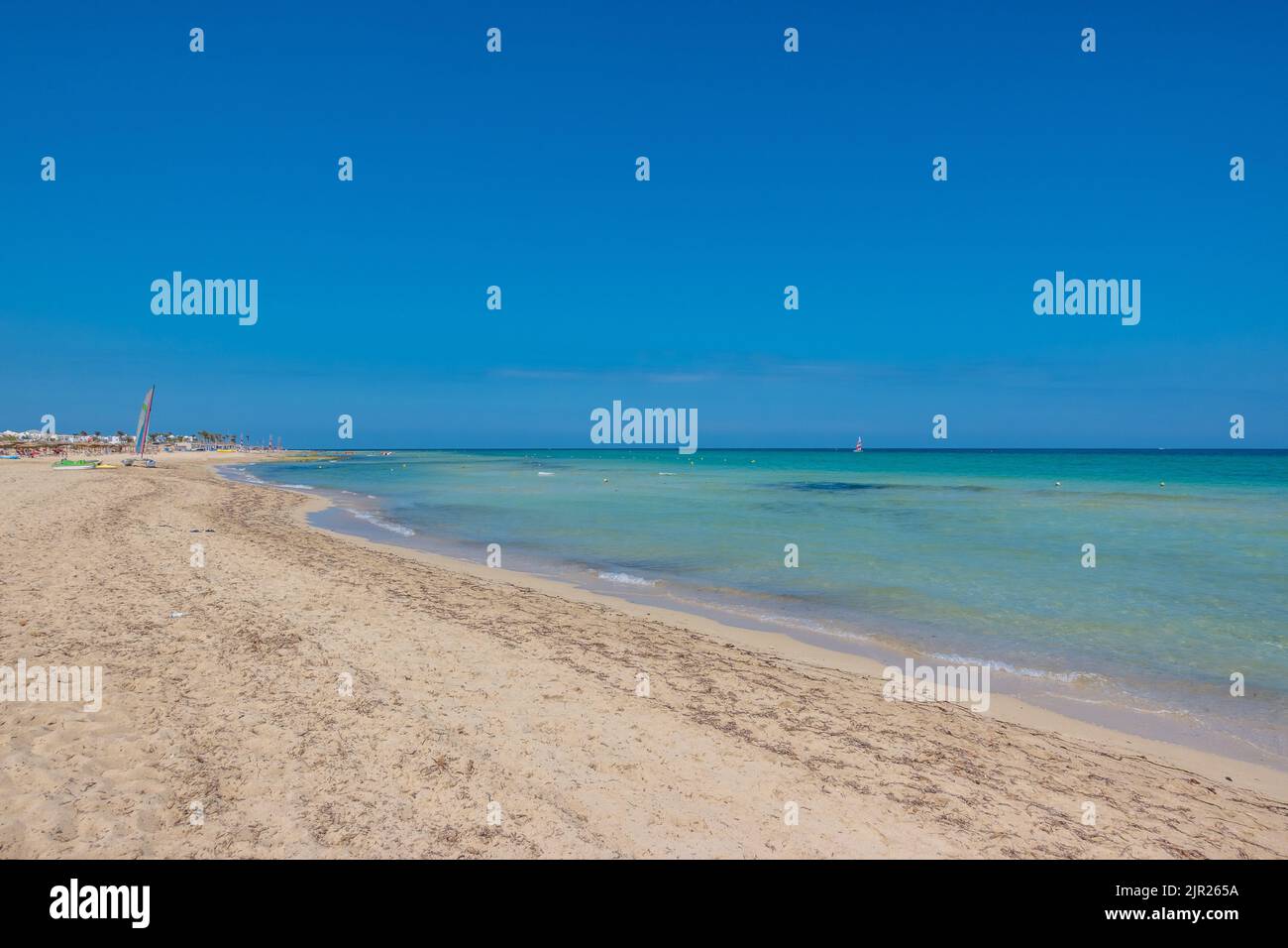 A beautiful beach with blue sky in Djerba, Tunisia Stock Photo - Alamy
