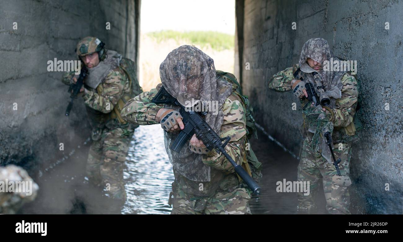 Covert entry into an enemy bunker - three mercenary soldiers walk ...