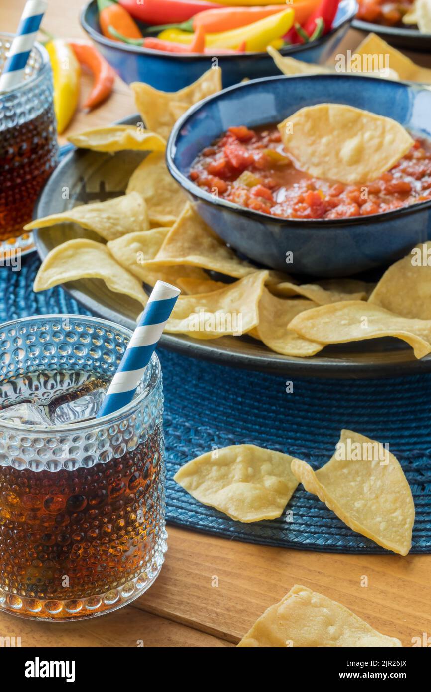 Authentic tortilla chips served with fresh gourmet salsa and soda pop ...