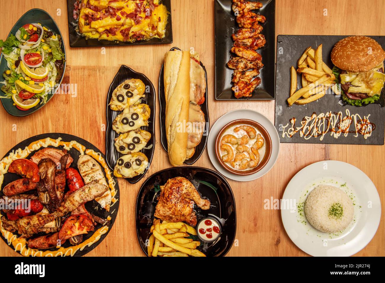 Set of fast food dishes, tray of roast meat, roasted half chicken with ...