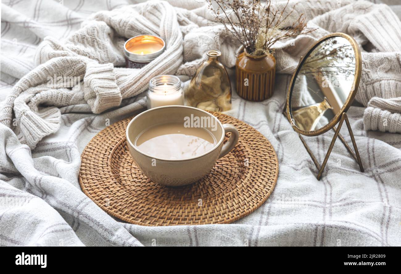 Cozy autumn composition with a cup of coffee and candles in bed Stock ...