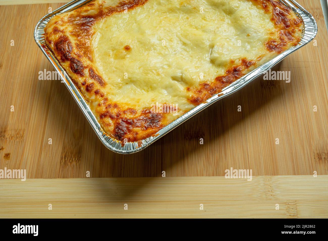 Lasagna from the supermarket baked in the oven, top view Stock Photo ...
