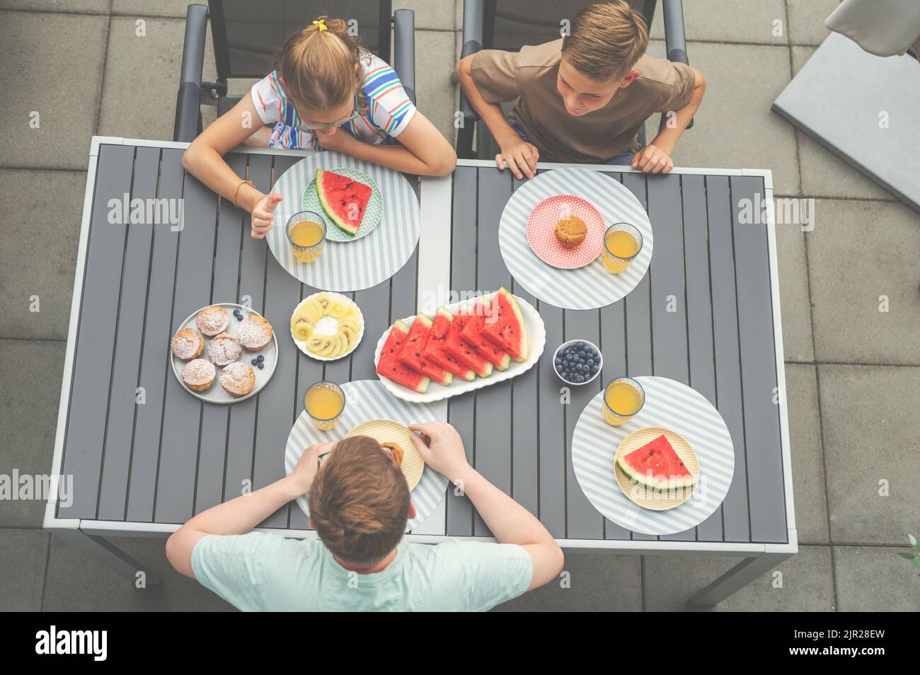 Happy family having brunch outdoors. Top view Stock Photo - Alamy