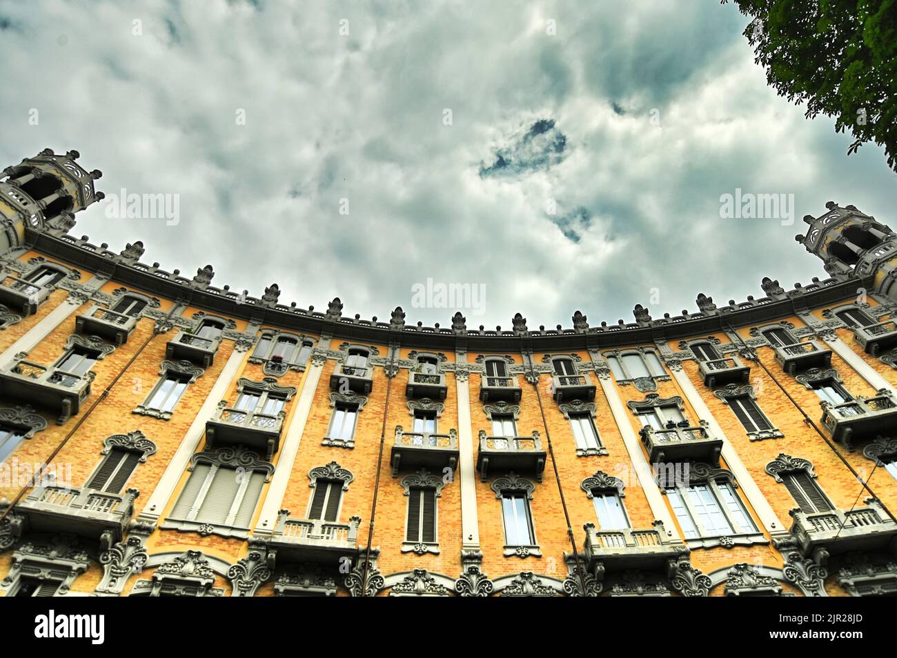 A low angle shot of a curved baroque-style residential building in ...