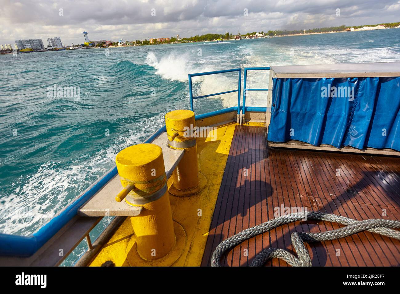View of a piece of the bow of a ferry while sailing at sea off Cancun ...