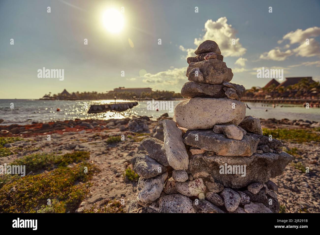 Detail of a stack of zen rocks in with behind the background of Puerto ...