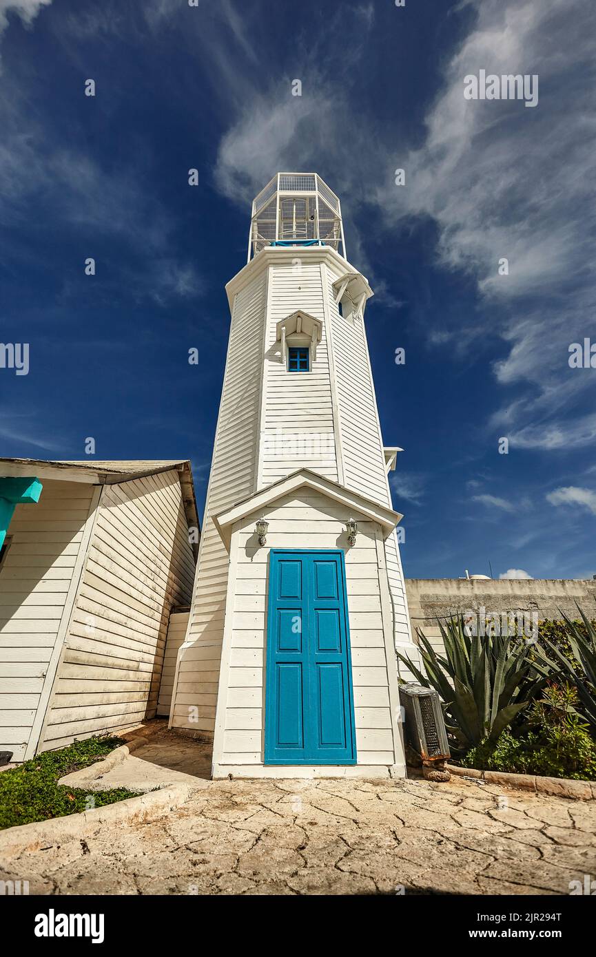 White and blue lighthouse: the lighthouse of Isla Mujeres in Mexico ...