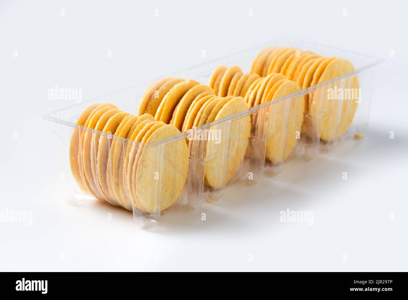 Round Crackers biscuits in plastic box isolated on white background ...