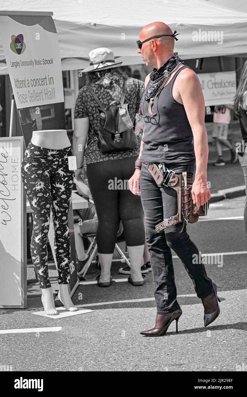 Man wearing leather holster and women's style, high heel shoes, Arts ...