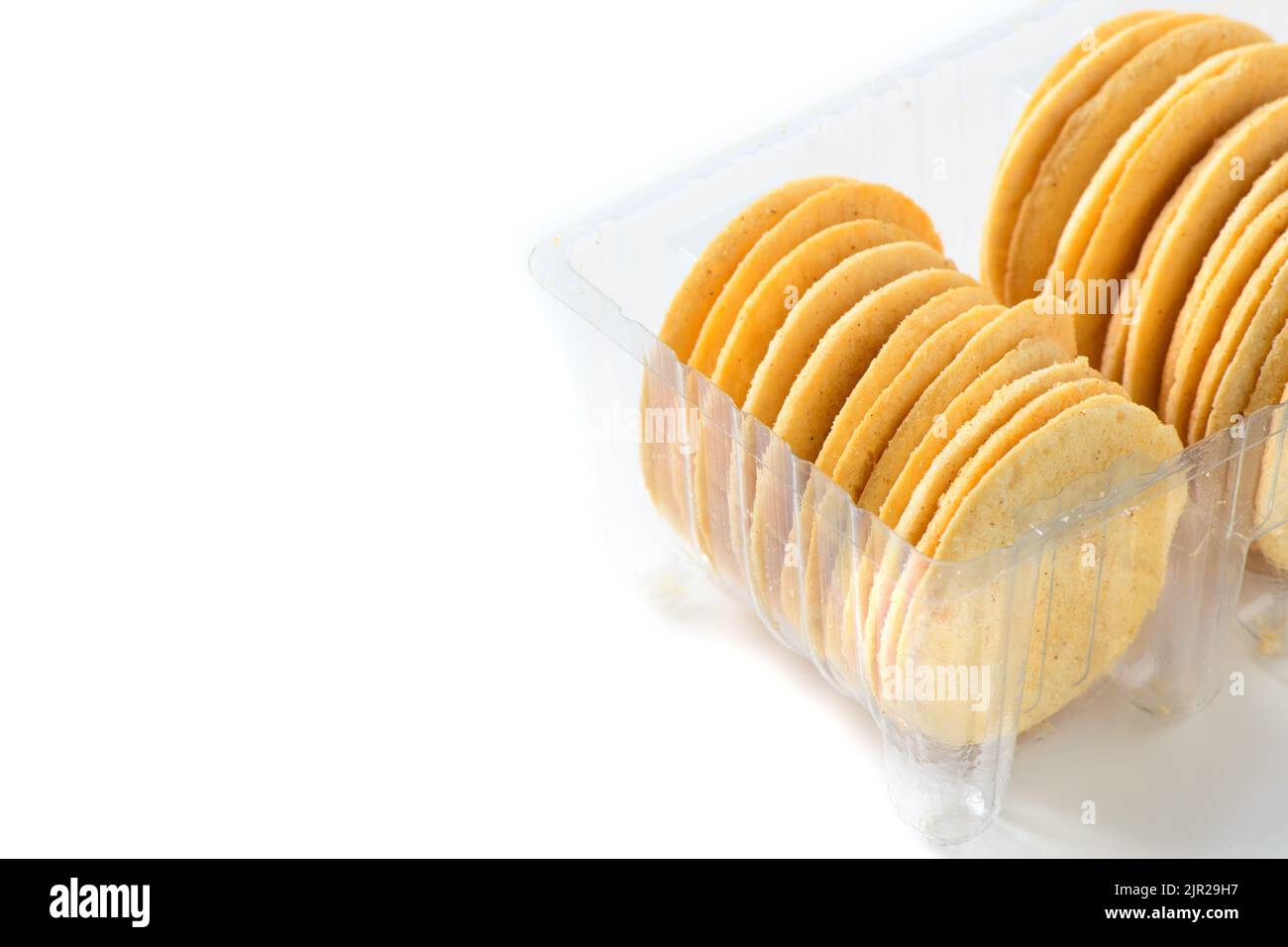 Round Crackers biscuits in plastic box isolated on white background ...