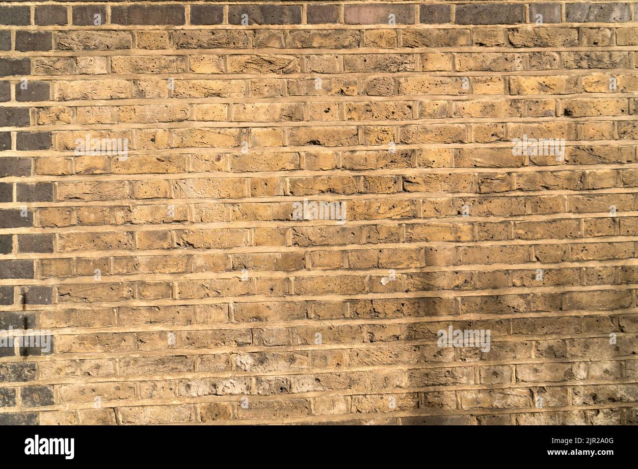 Detail of brick wall built with yellow bricks well visible texture and ...