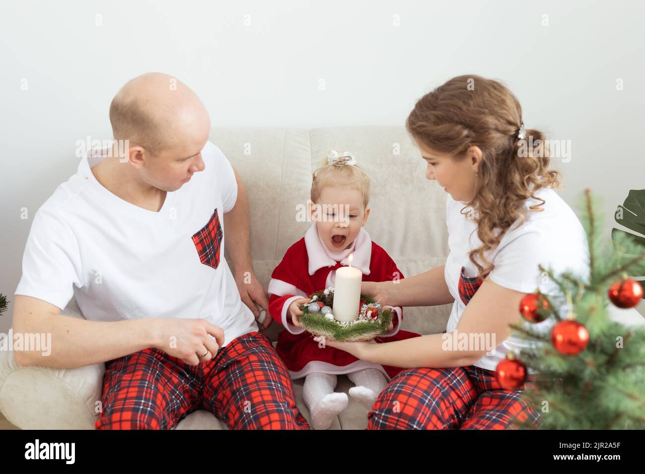 Child with cochlear implant hearing aid having fun with parents in ...
