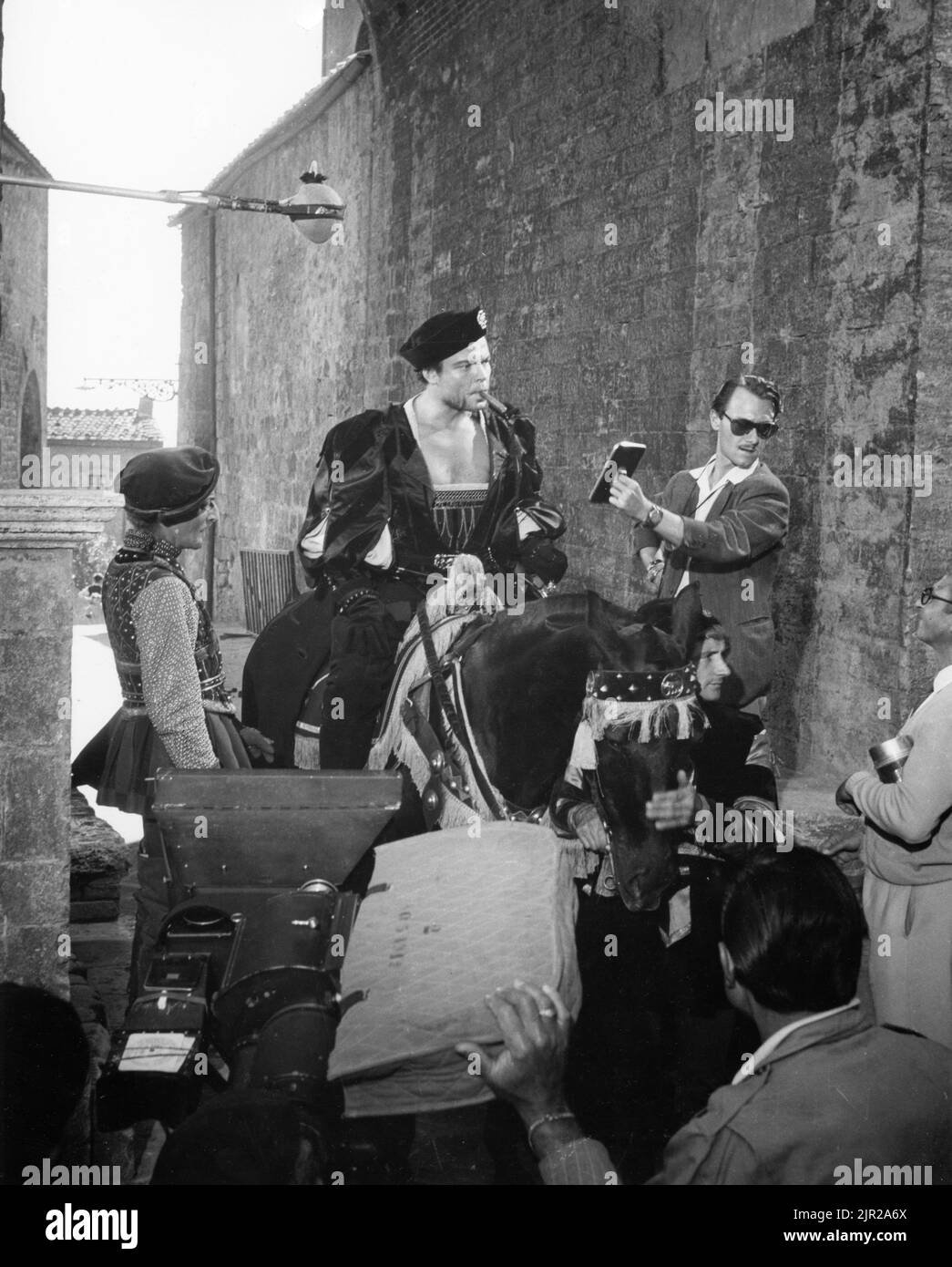 EVERETT SLOANE and ORSON WELLES (in costume as Cesare Borgia) on set location candid in 1948 ...