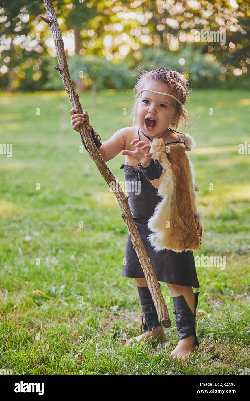 Cute baby dressed in the clothes of primitive people Stock Photo - Alamy
