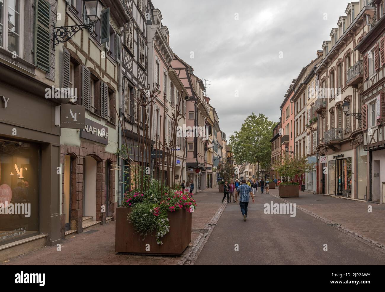 People on a pedestrian street in the historic center of Colmar, Alsace ...