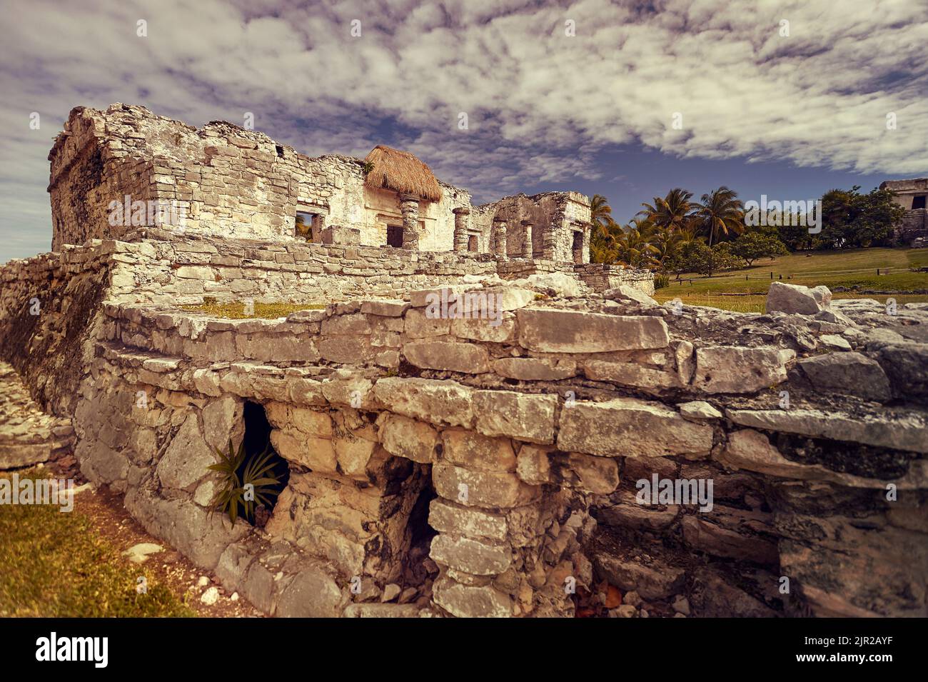 Side view of the remains of a small Mayan temple in the Tulum complex ...