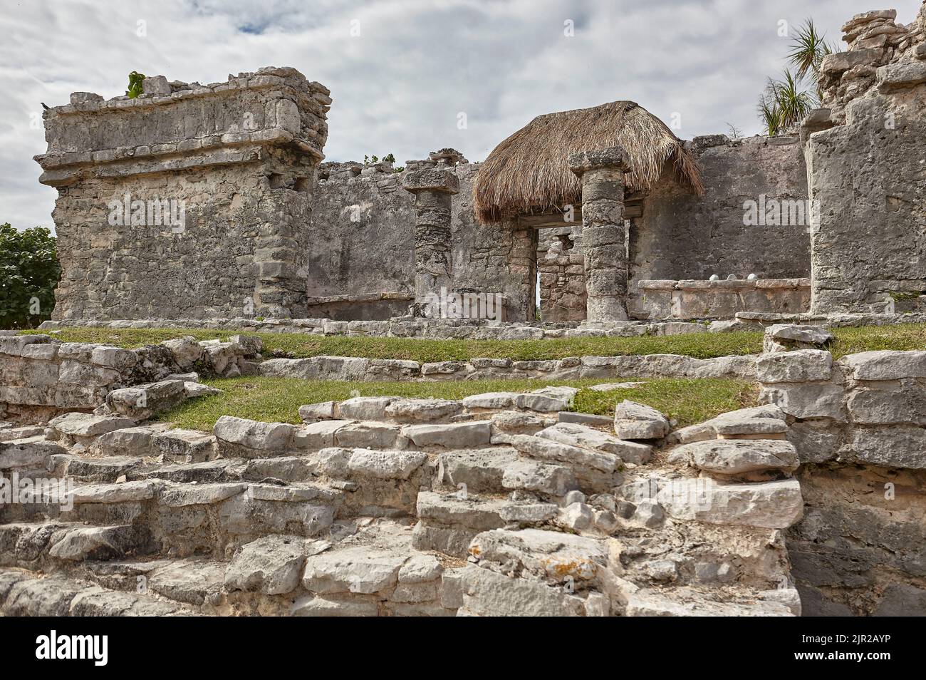 Side view of the remains of a small Mayan temple in the Tulum complex ...