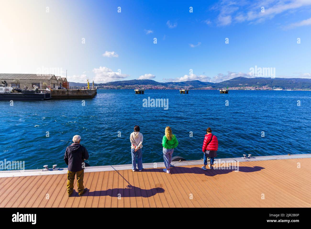 people fishing near the boardwalk of the sea Stock Photo - Alamy