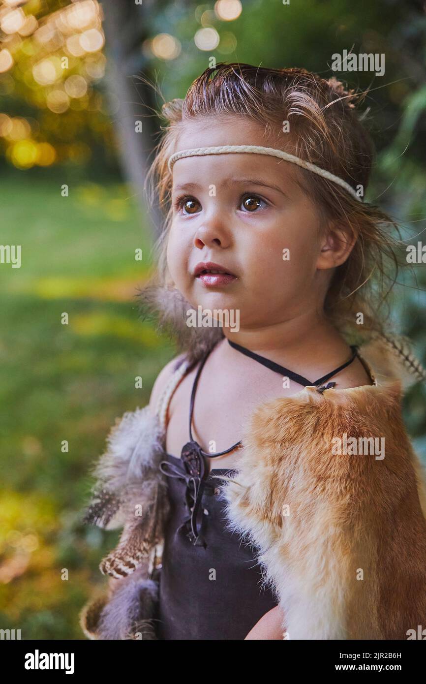 Cute baby dressed in the clothes of primitive people Stock Photo - Alamy