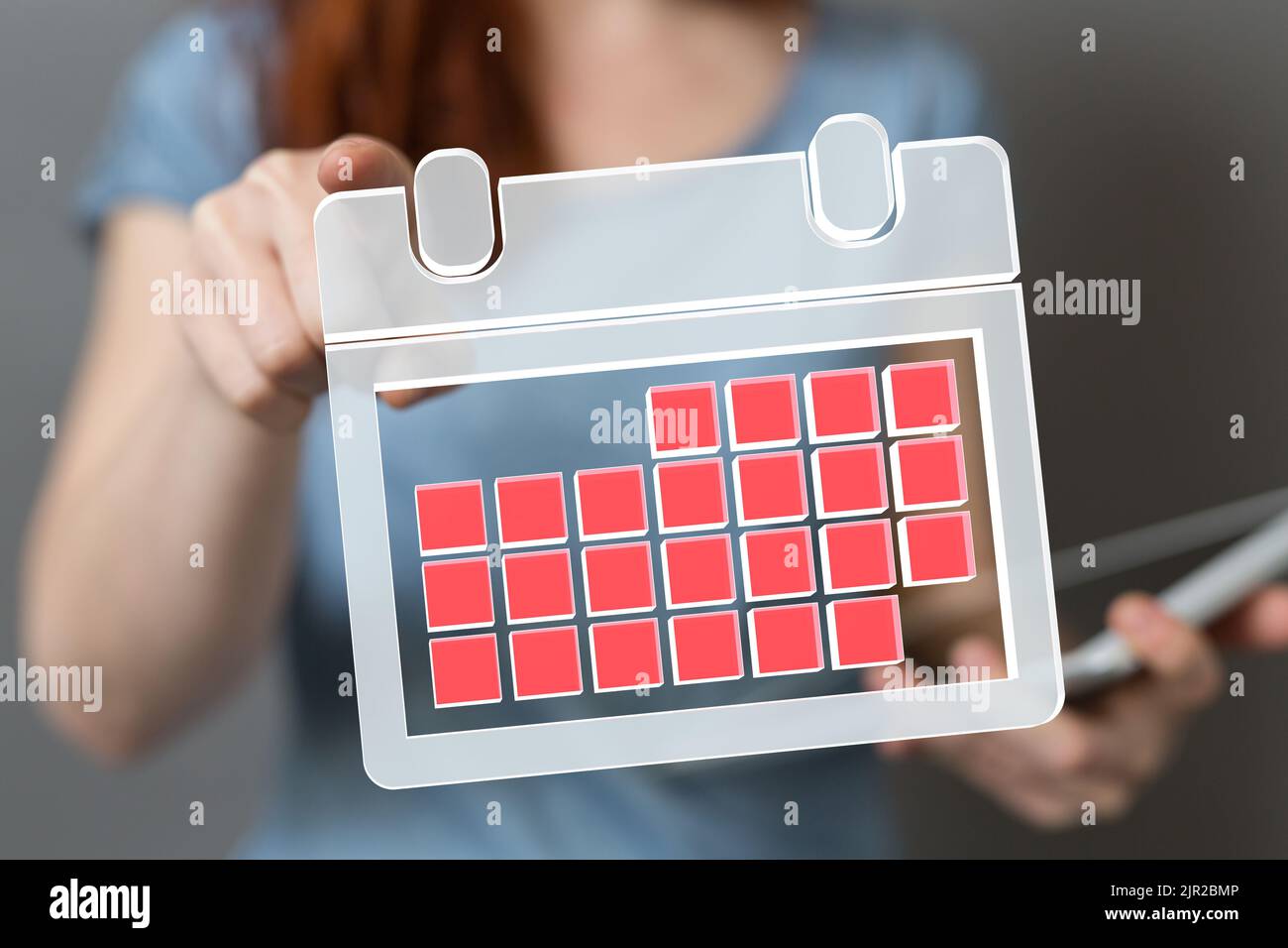 A finger touching a 3d rendering of a calendar Stock Photo - Alamy
