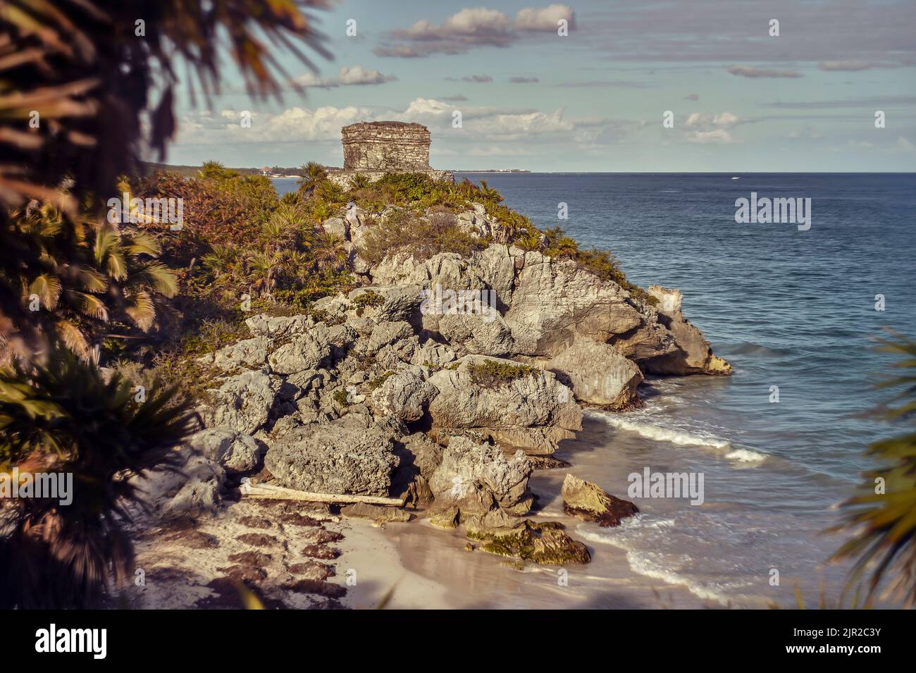 Rocky promontory overlooking the Caribbean Sea with an ancient Mayan ...