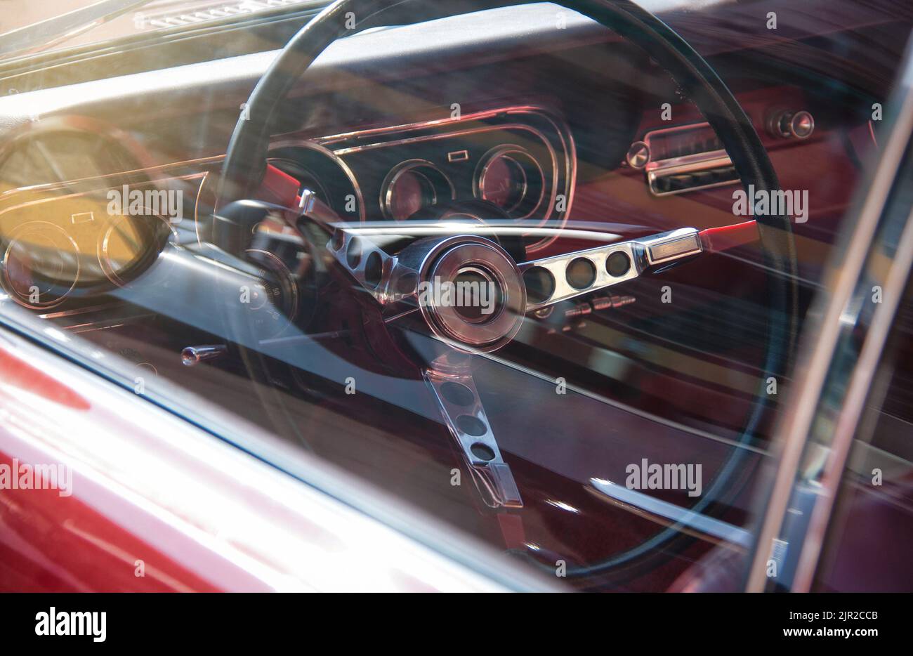 Steering wheel and part of the interior of an American sports car ...
