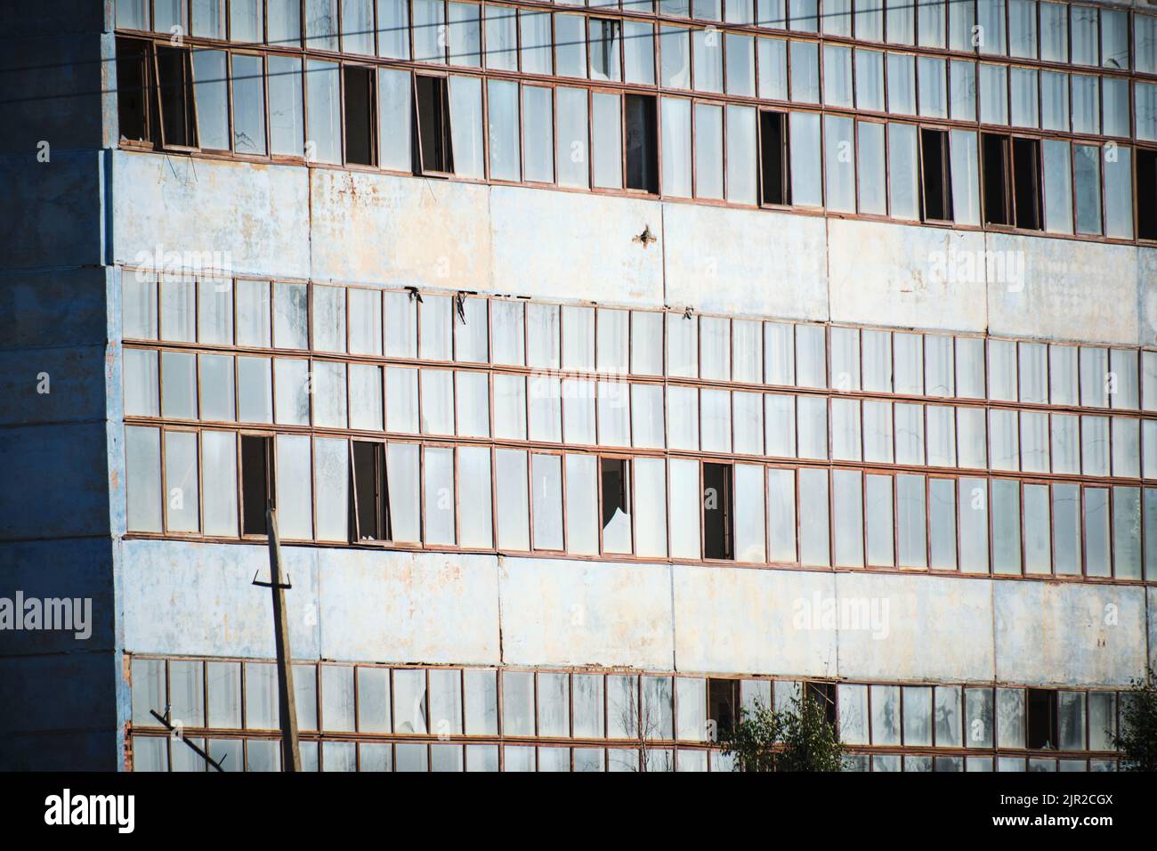 Broken glass facade old, industrial, abandoned factory building Stock ...