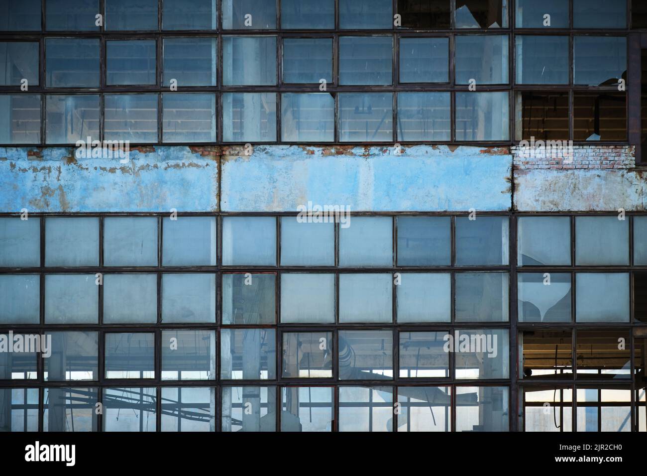 Broken glass facade old, industrial, abandoned factory building Stock ...