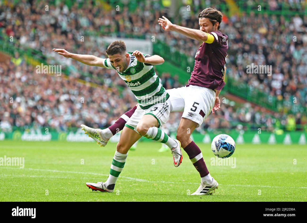 Glasgow, Scotland, 21st August 2022. Greg Taylor of Celtic and Peter ...