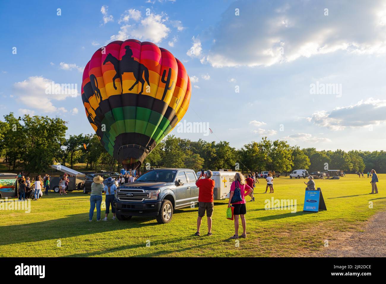 Oklahoma, AUG 12 2022 - Cowboy art of a hot air balloon in the Firelake ...