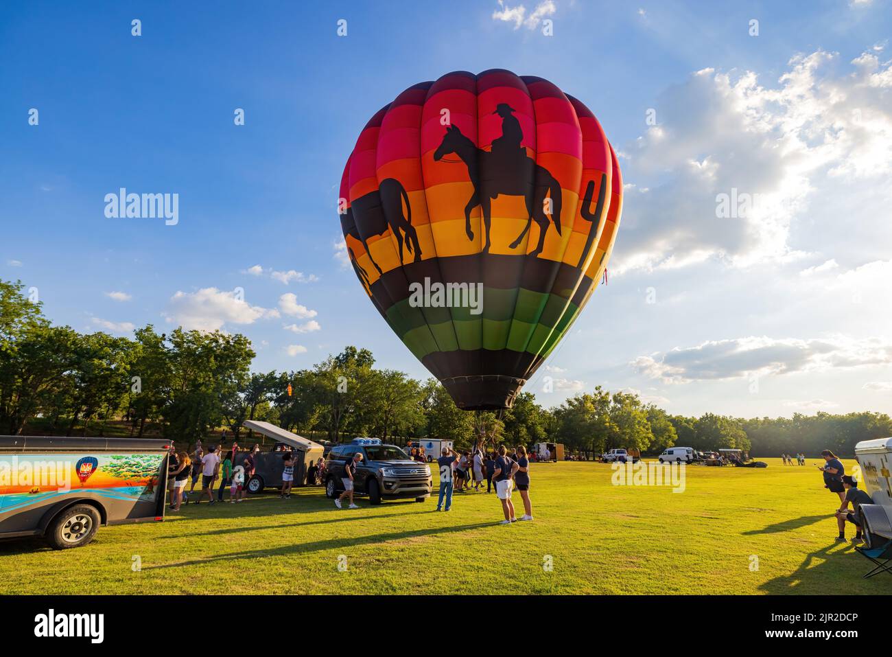 Oklahoma, AUG 12 2022 - Cowboy art of a hot air balloon in the Firelake ...
