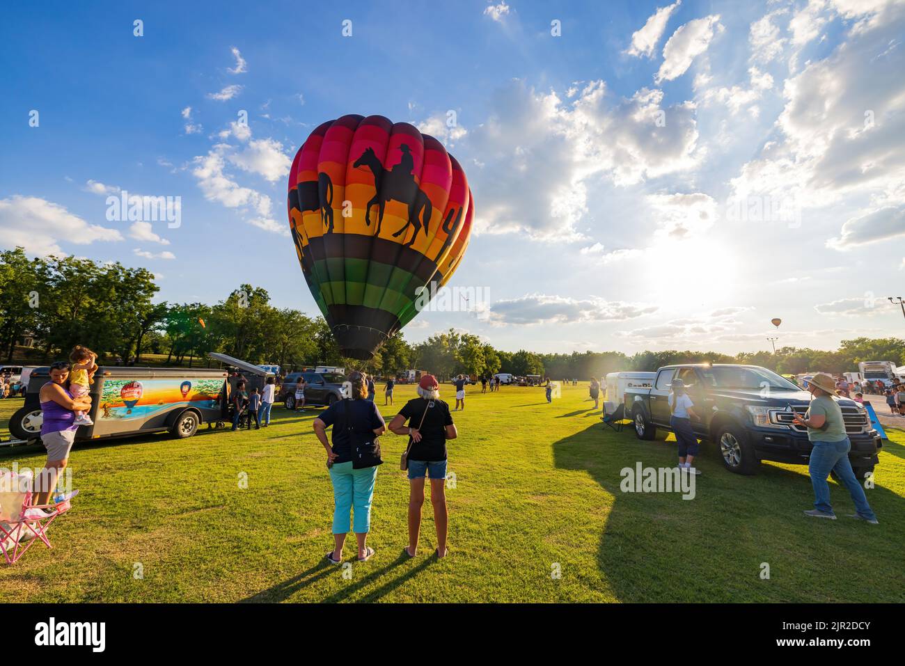 Oklahoma, AUG 12 2022 - Cowboy art of a hot air balloon in the Firelake ...