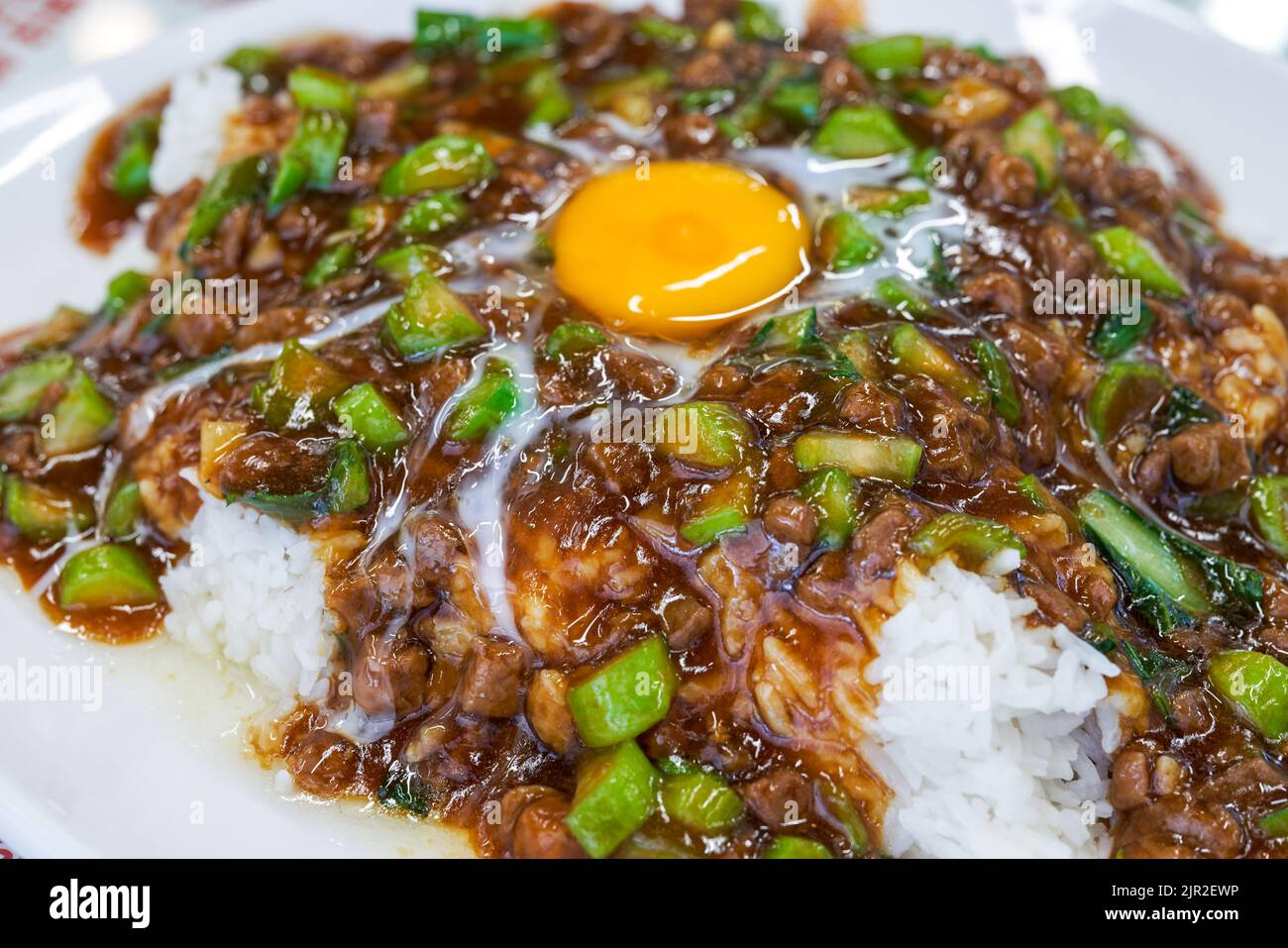 A plate of delicious and tempting nest egg minced beef rice in a Hong ...