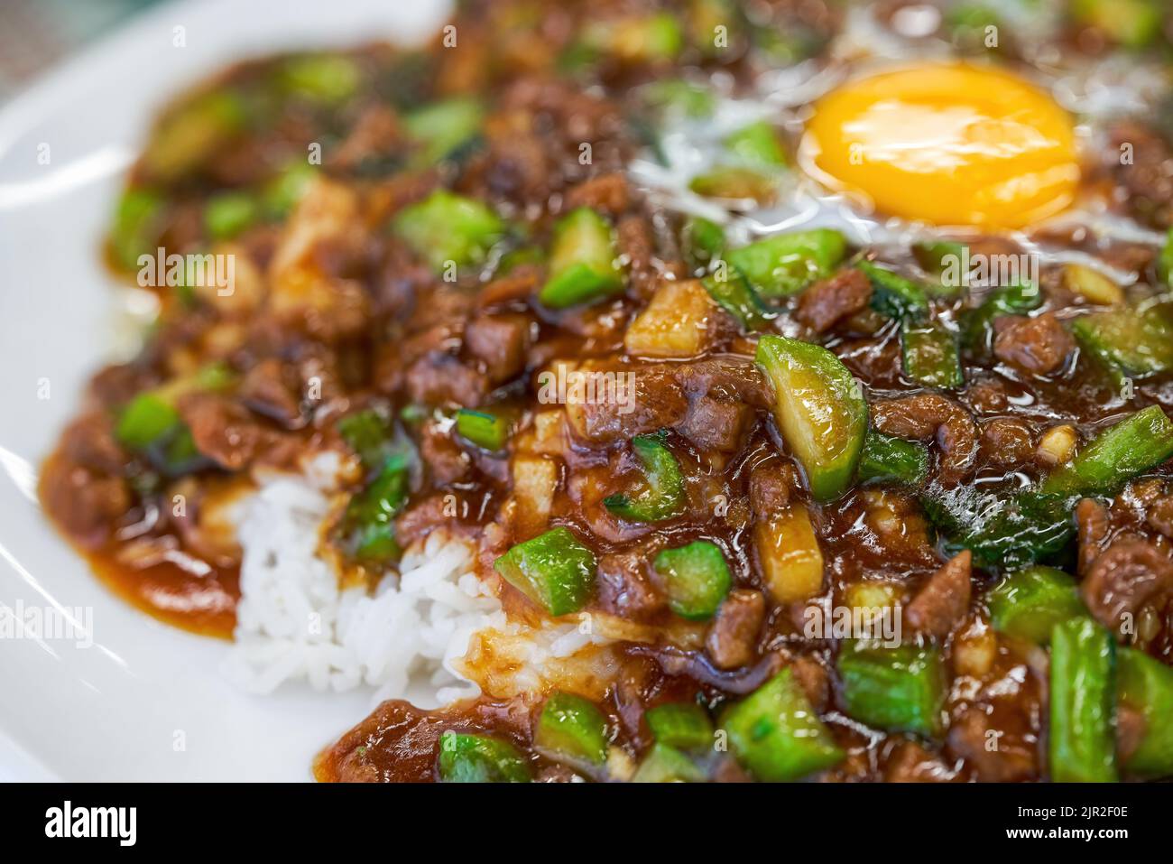 A plate of delicious and tempting nest egg minced beef rice in a Hong ...