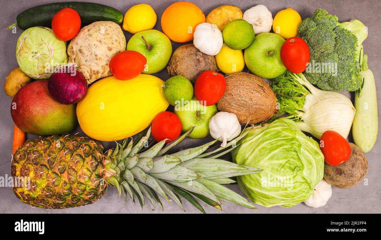 Dark grey background with fresh fruits and vegetables. Flat lay healthy ...