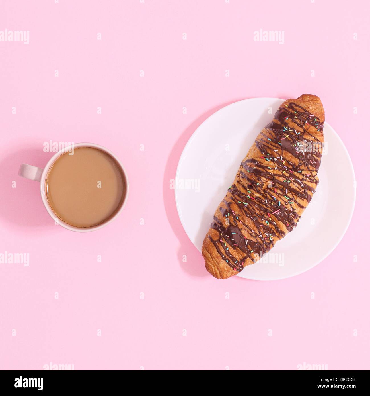 Fresh delicious croissant with chocolate and with cup of coffee on ...